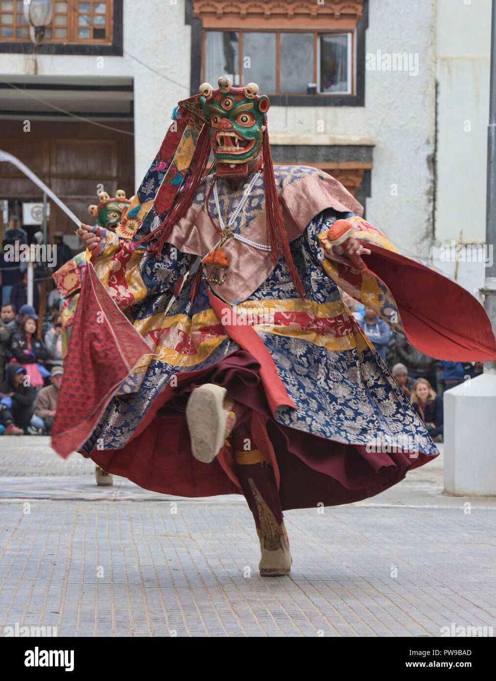 A masked monk dances at a traditional Tibetan Buddhist Cham dance , Leh ...