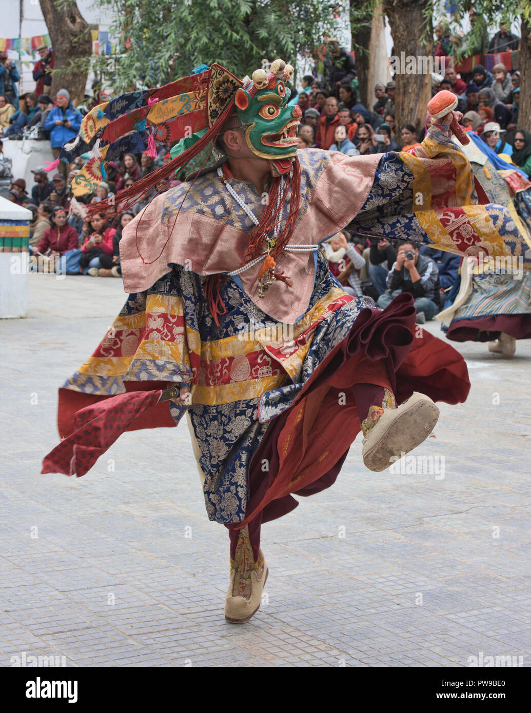 A masked monk dances at a traditional Tibetan Buddhist Cham dance , Leh ...