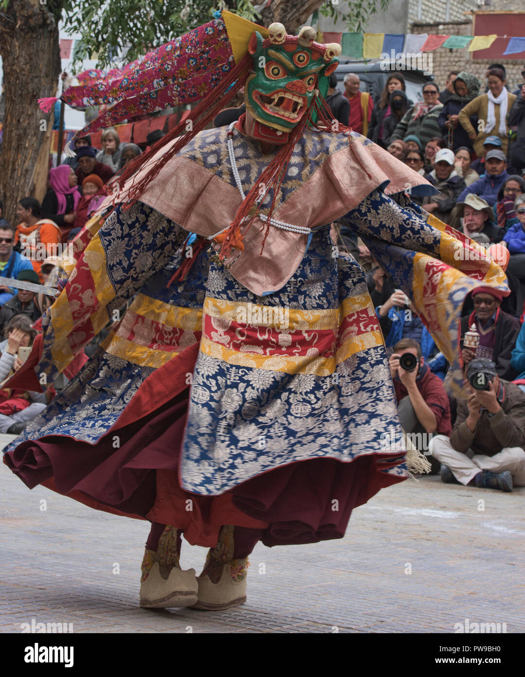 A masked monk dances at a traditional Tibetan Buddhist Cham dance , Leh ...