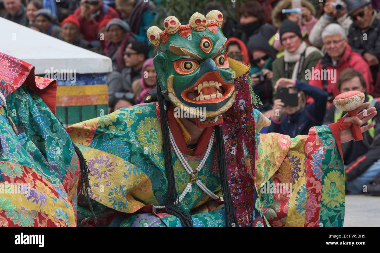 A masked monk performing at a traditional Tibetan Buddhist Cham dance ...
