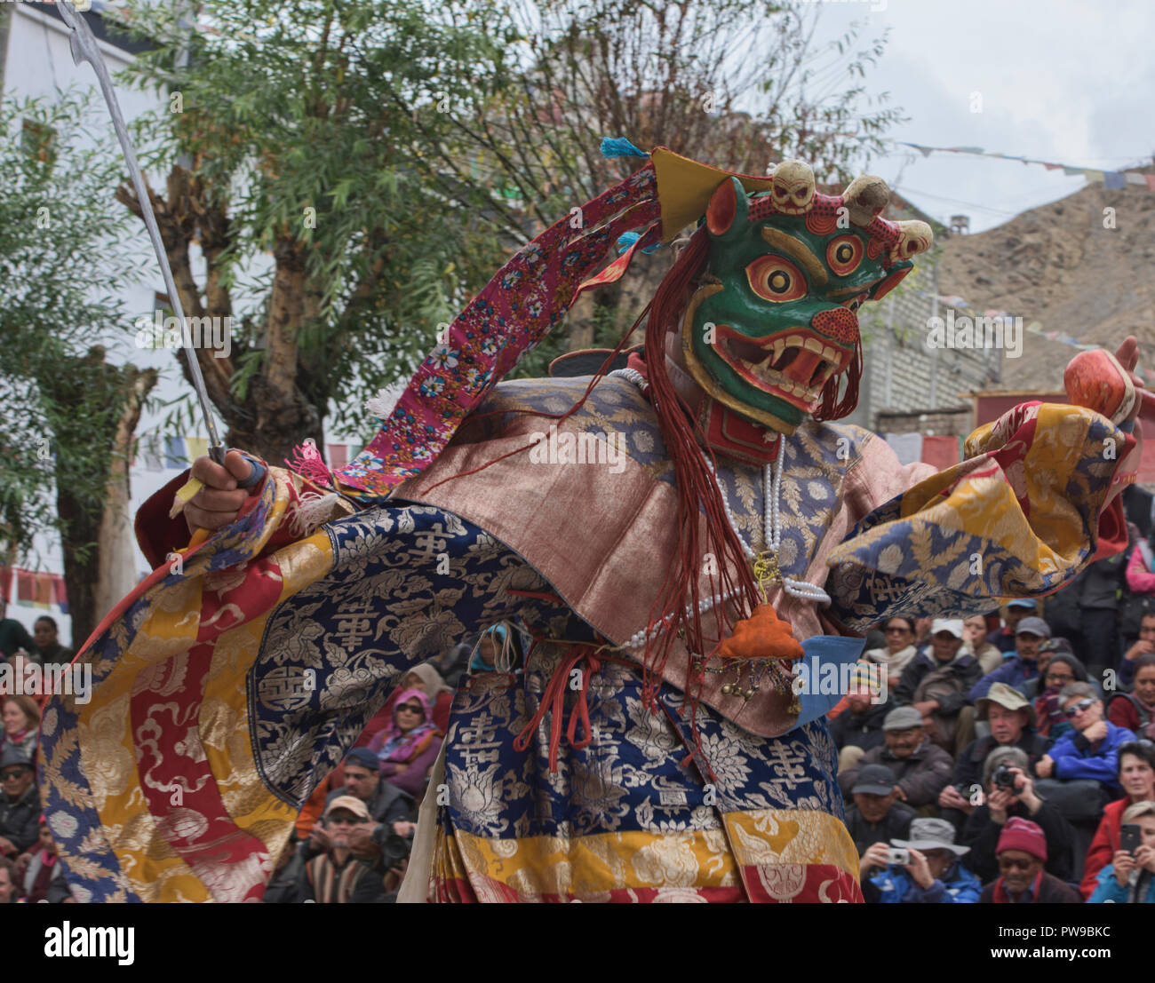 A masked monk performing at a traditional Tibetan Buddhist Cham dance ...