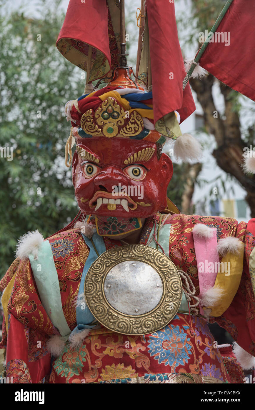 A masked monk performing at a traditional Tibetan Buddhist Cham dance ...