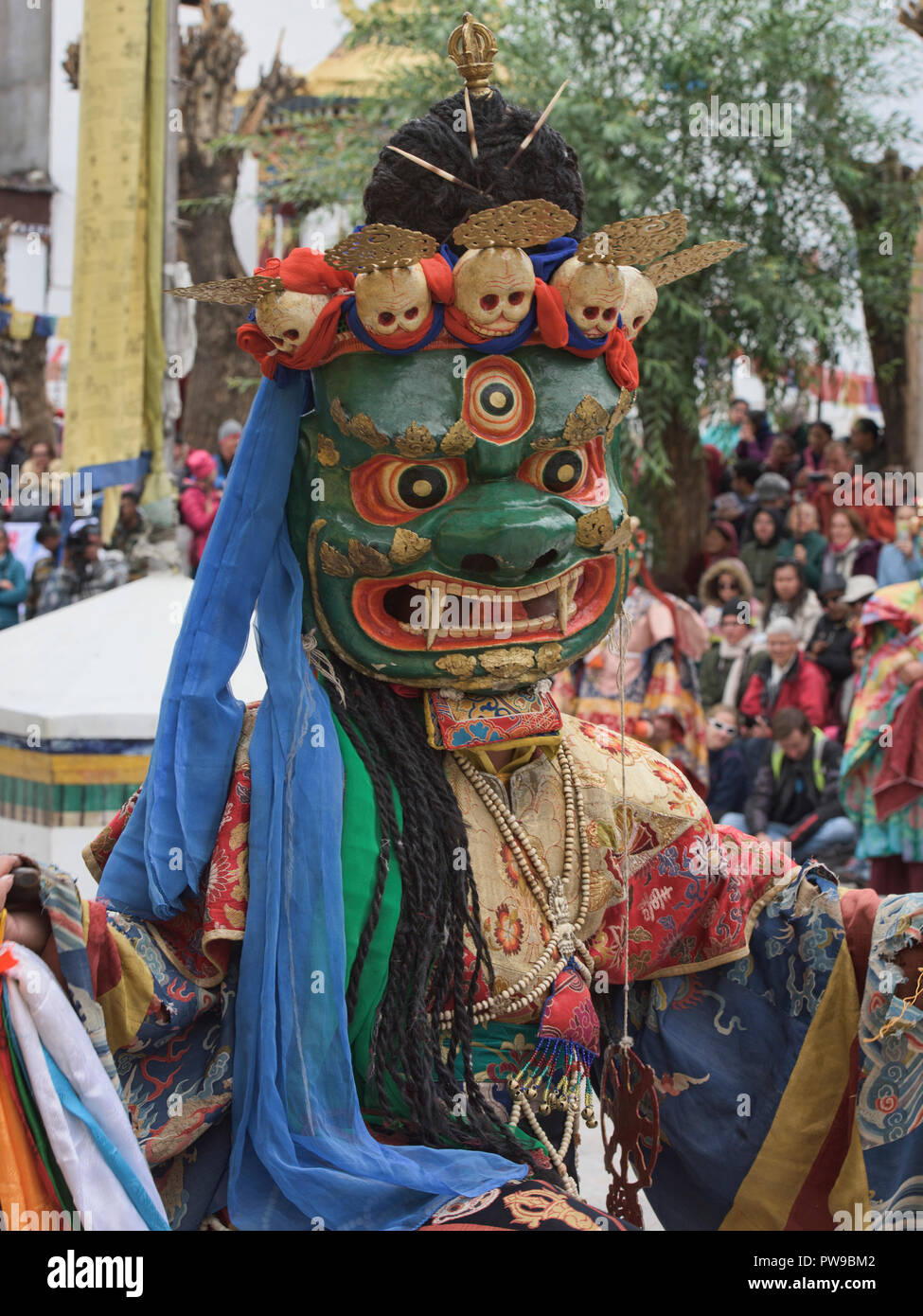 A masked monk performing at a traditional Tibetan Buddhist Cham dance ...