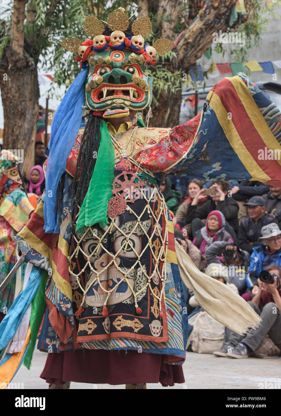 A masked monk dances at a traditional Tibetan Buddhist Cham dance , Leh ...
