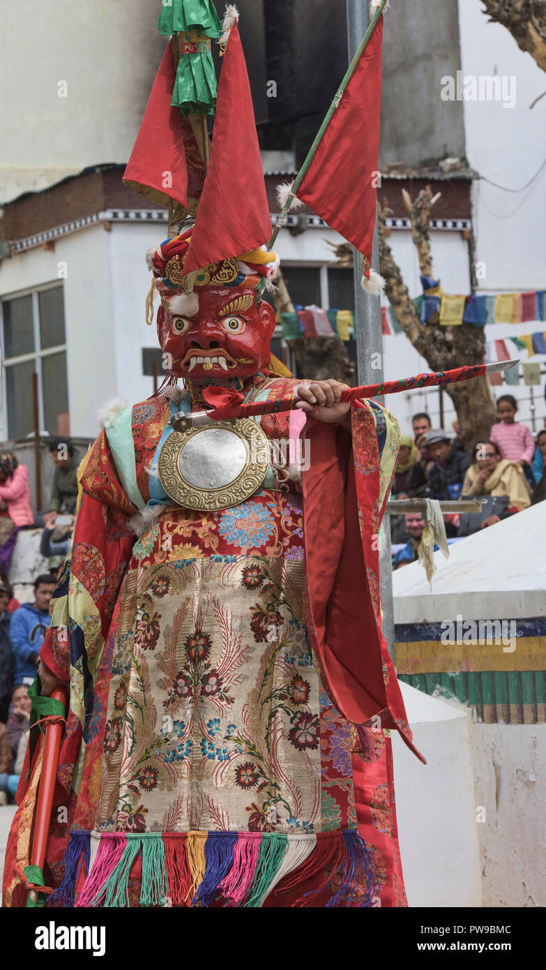 A masked monk performing at a traditional Tibetan Buddhist Cham dance ...