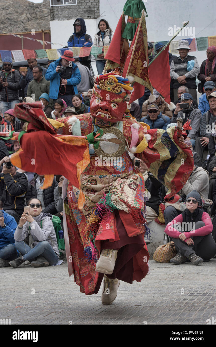 A masked monk performs at a traditional cham Tibetan Buddhist dance ...