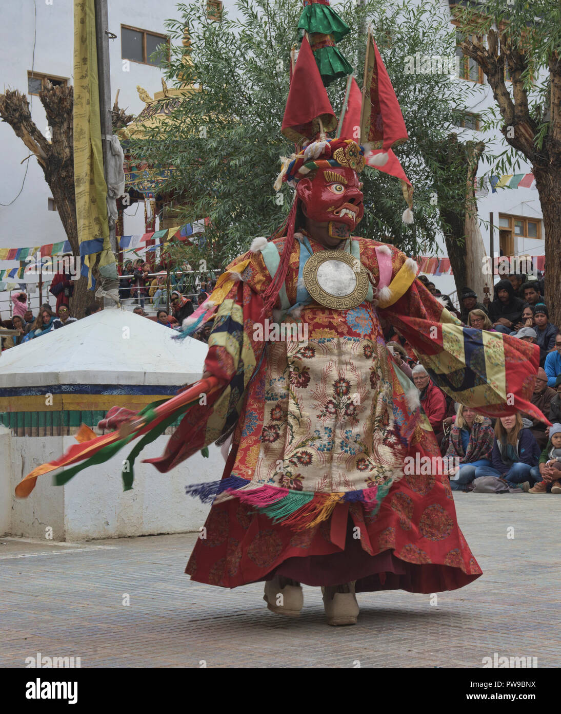 A masked monk performs at a traditional cham Tibetan Buddhist dance ...