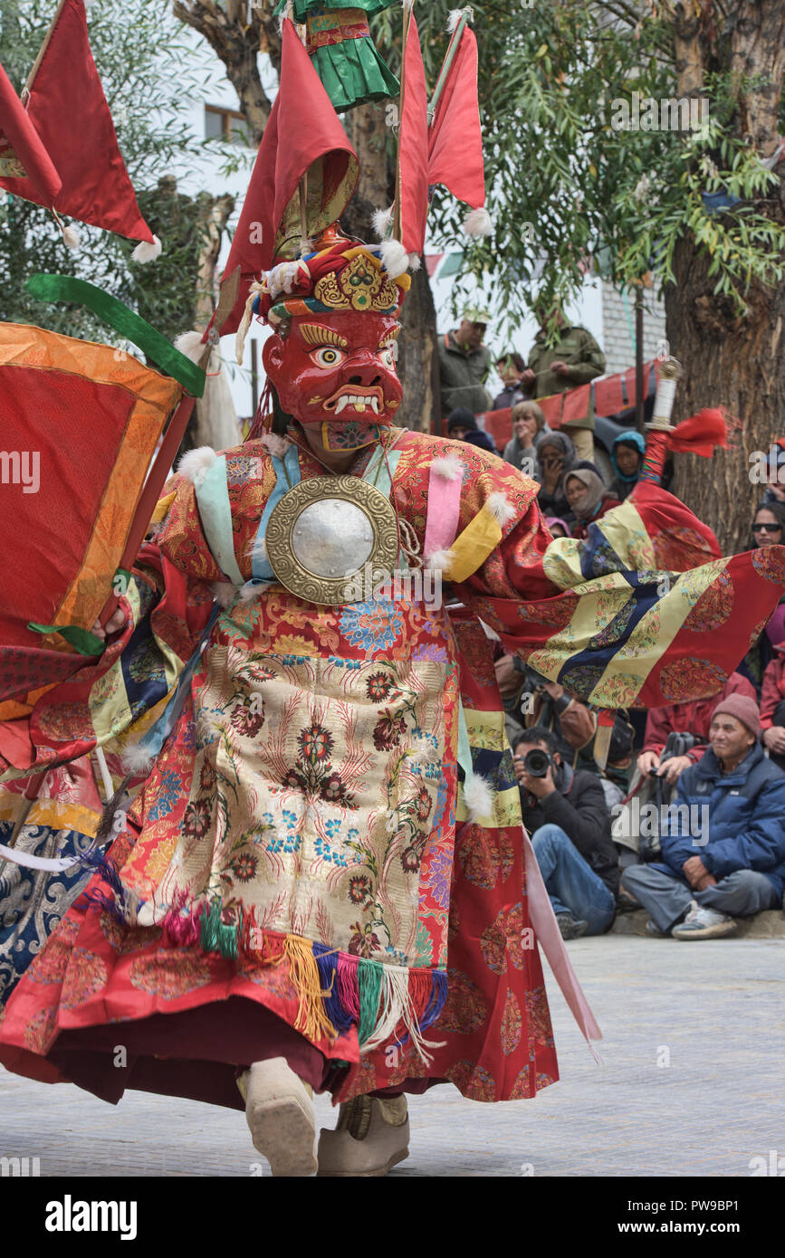 A masked monk performs at a traditional cham Tibetan Buddhist dance ...
