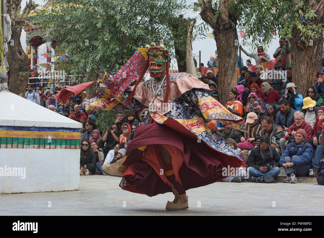 Spinning monk dancing at a traditional cham masked dance, Leh, Ladakh ...