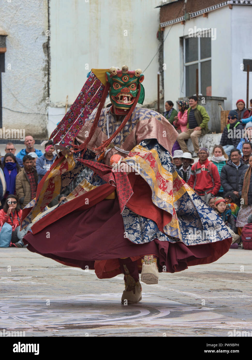 Spinning monk dancing at a traditional cham masked dance, Leh, Ladakh ...