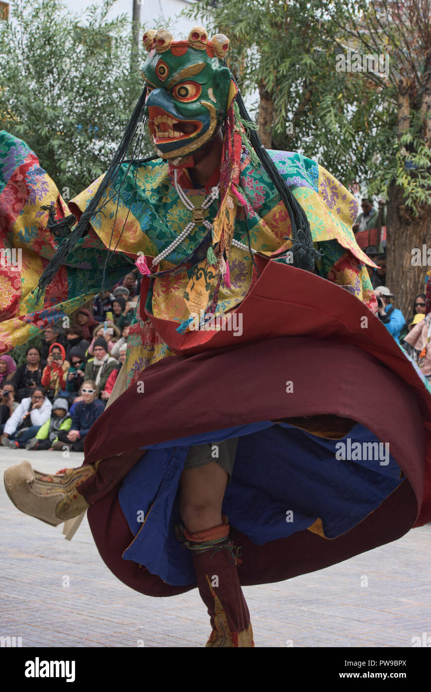 Spinning monk dancing at a traditional cham masked dance, Leh, Ladakh ...
