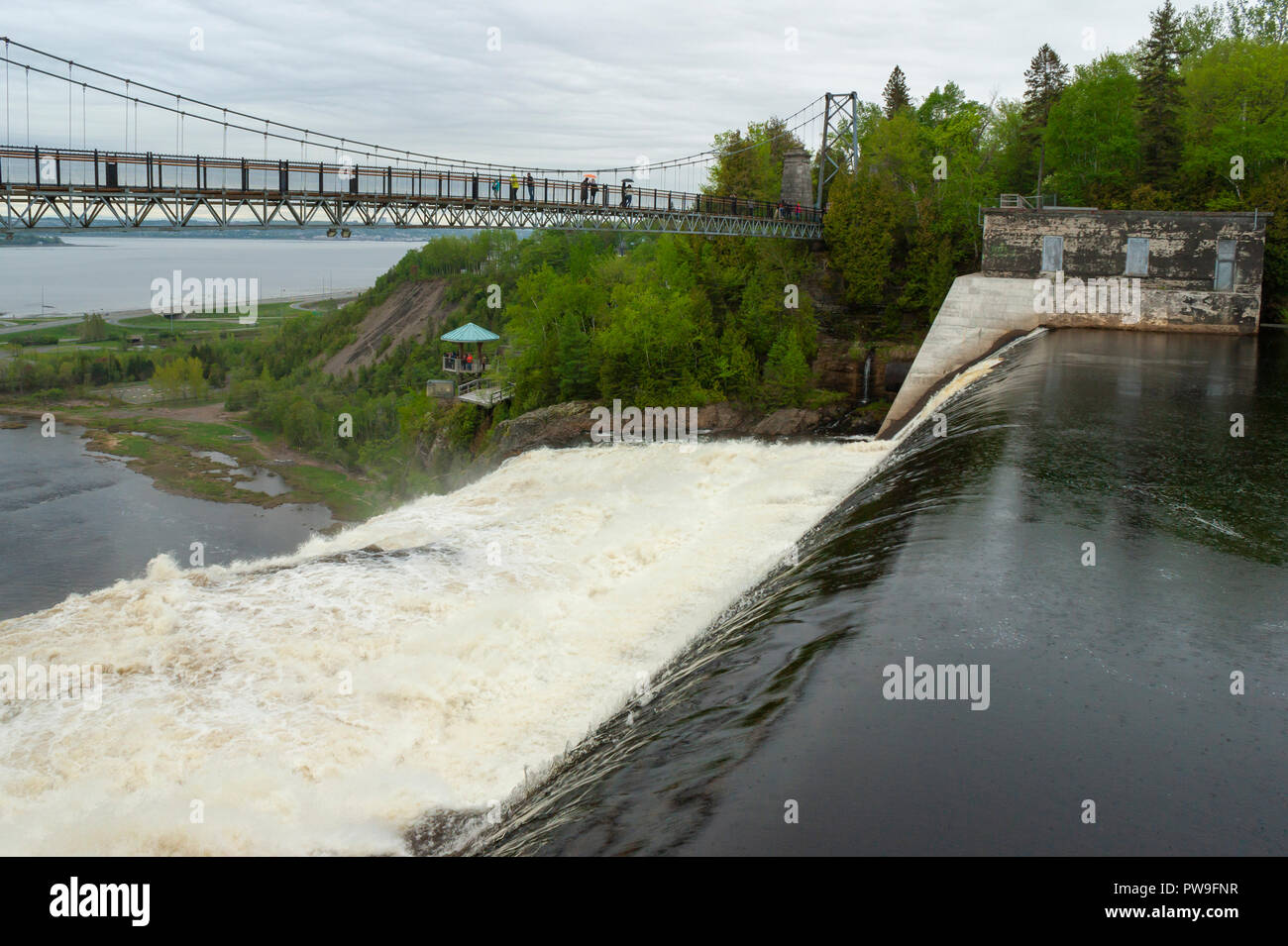 The cascading waters of the Montmorency Falls plunging down a precipice ...