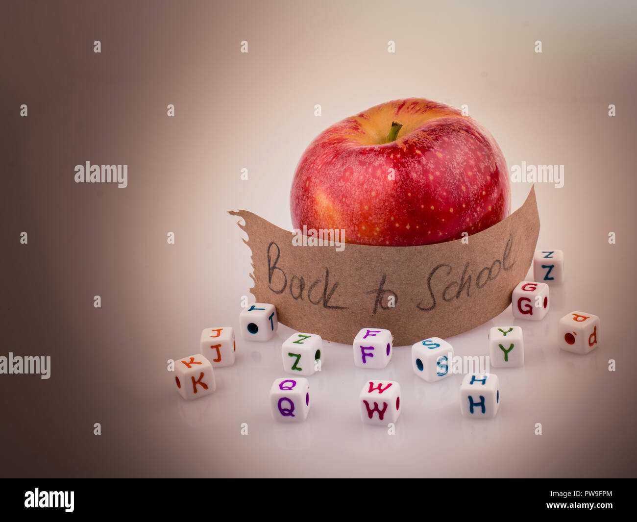Back to school theme with a red apple Stock Photo - Alamy