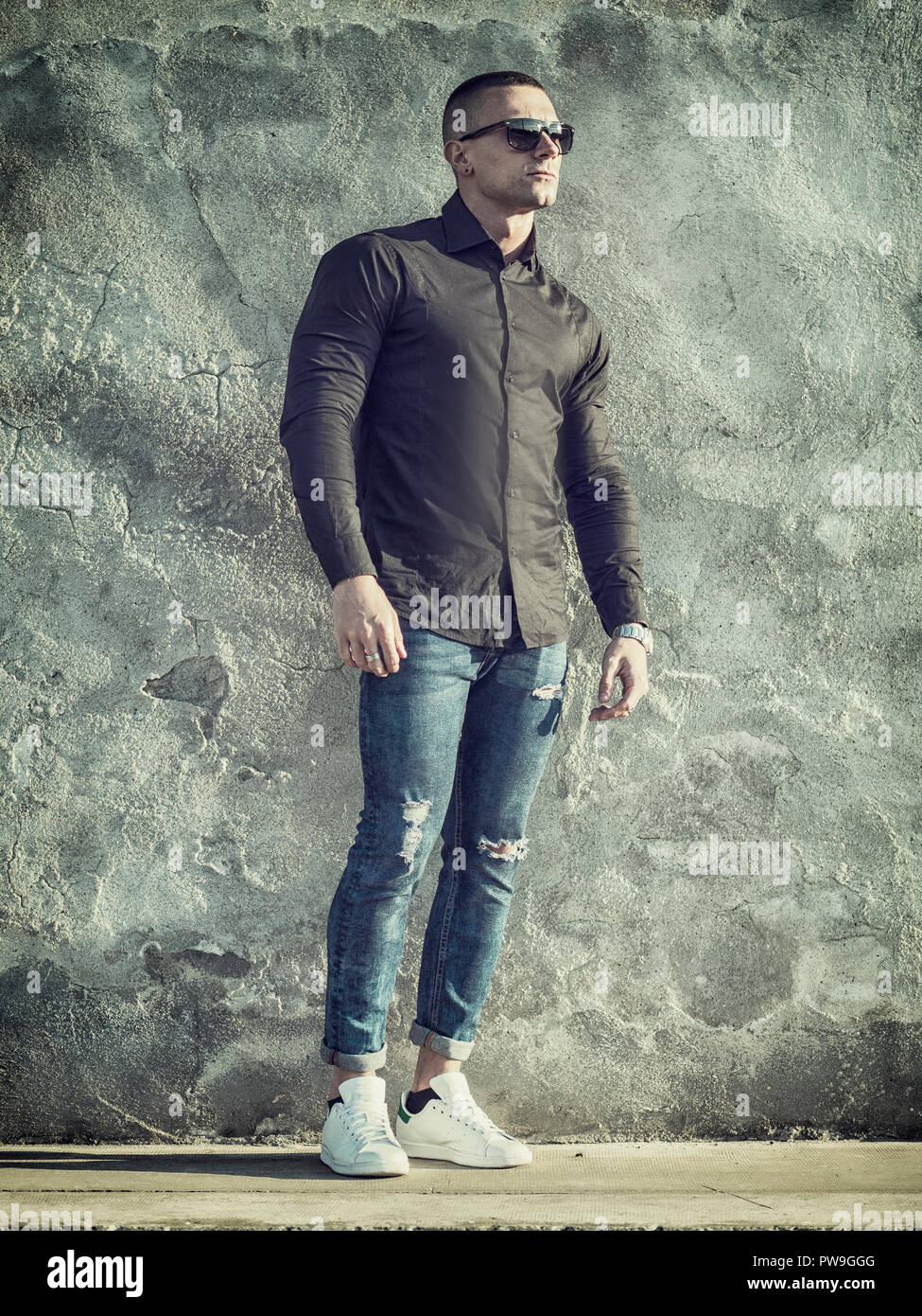 One handsome young man in city setting Stock Photo - Alamy