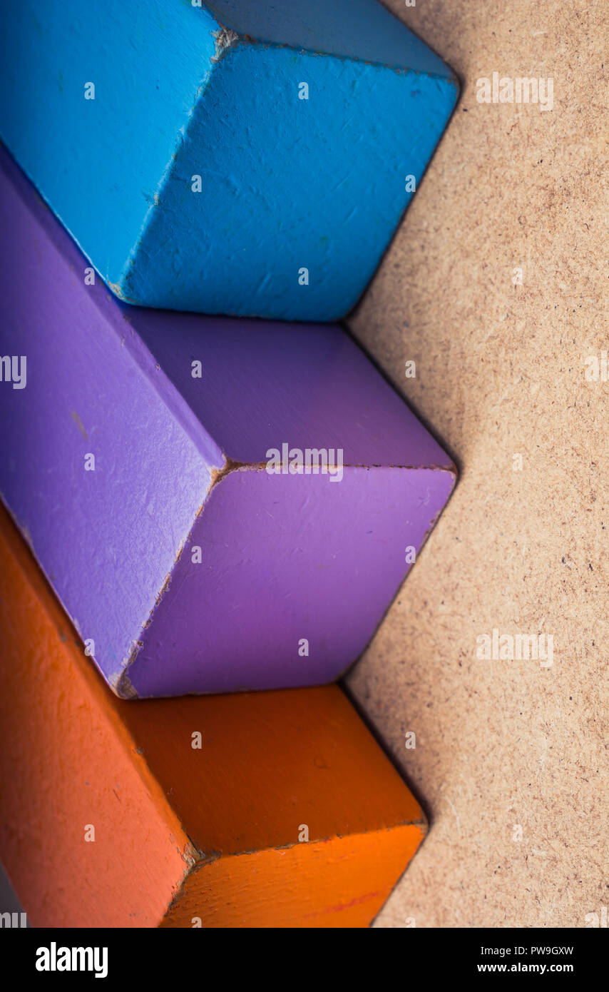 Colorful building blocks on a brown background Stock Photo - Alamy