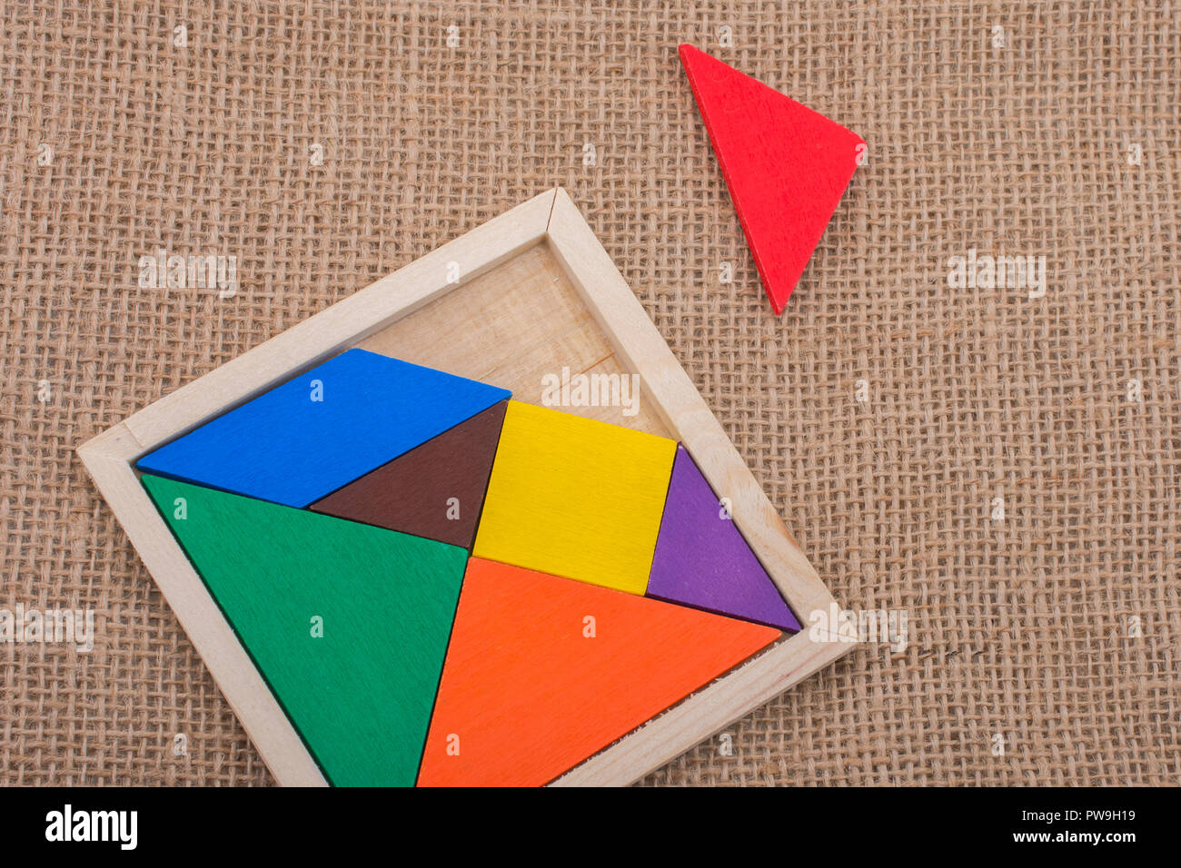 Colorful pieces of a square tangram puzzle Stock Photo - Alamy