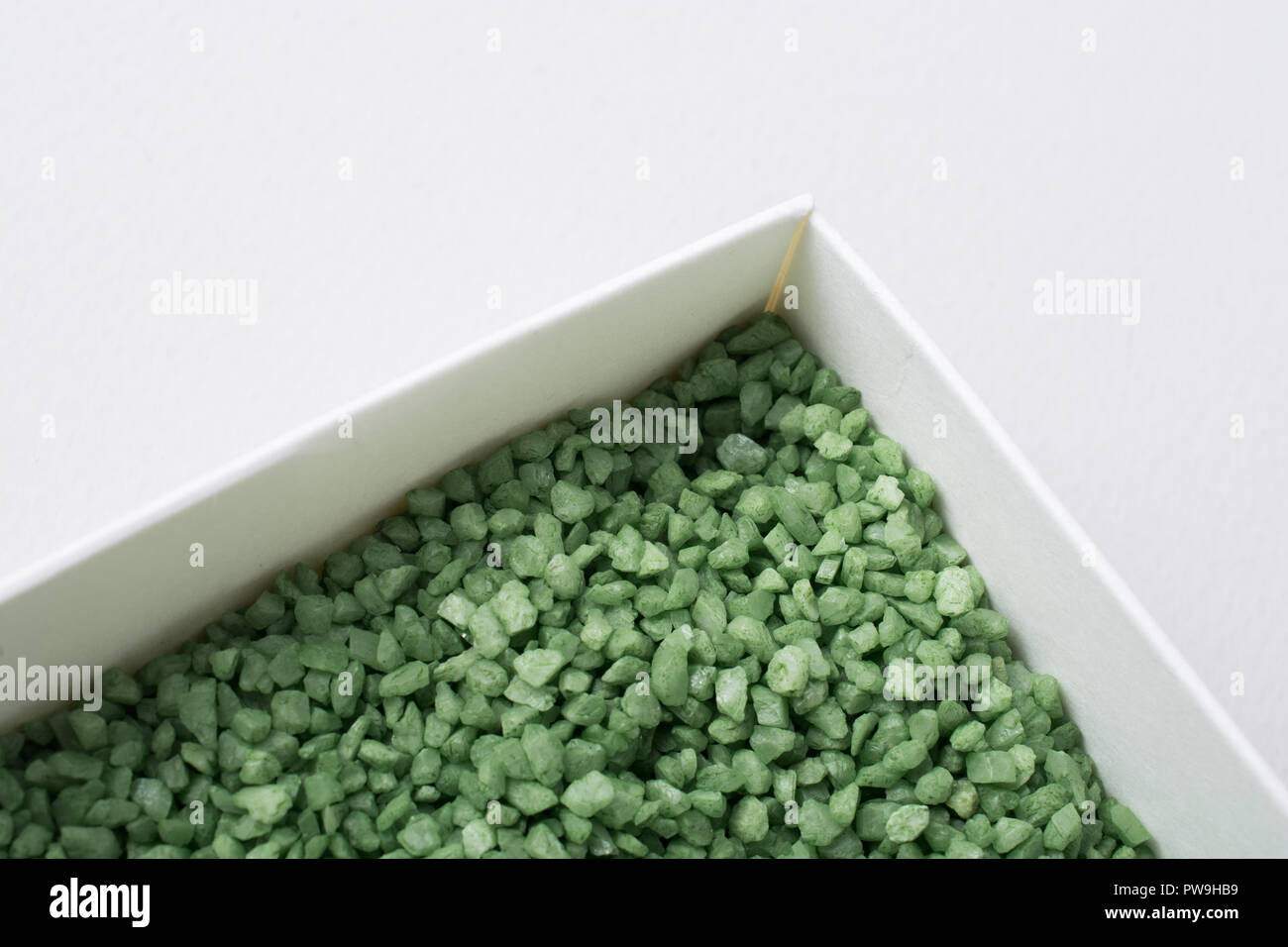 Little green color sand in box as a background texture Stock Photo - Alamy