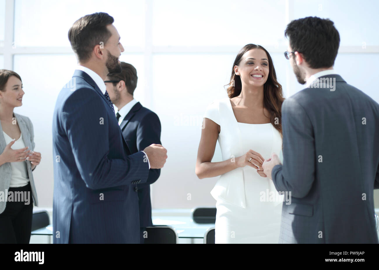group of employees standing in the office Stock Photo - Alamy