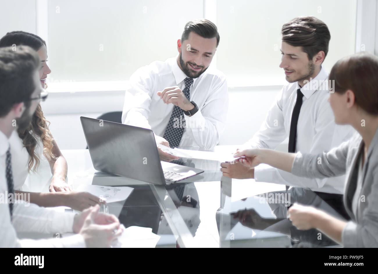business team discusses business documents Stock Photo - Alamy