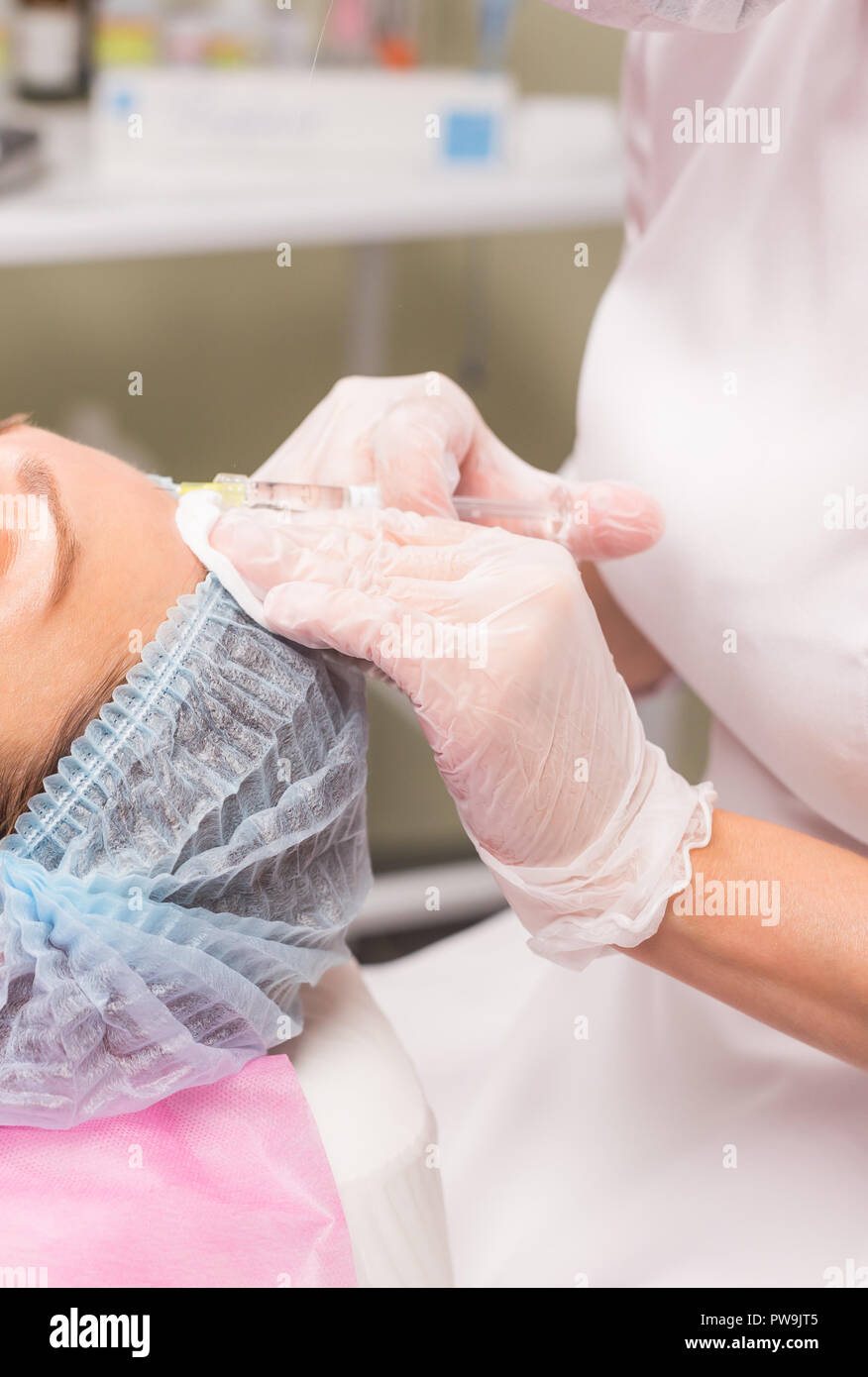 People and cosmetology concept - Close up of hands of expert beautician ...