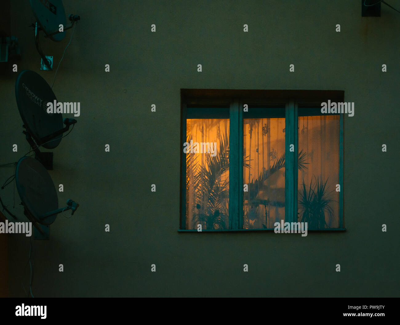 house window at night orange light tropic Stock Photo - Alamy