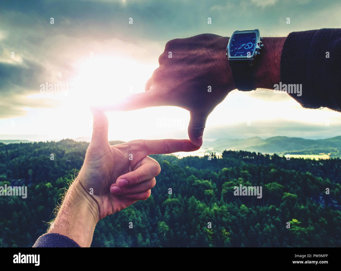 Frame made of hands and nature landscape. Palms with fingers making a ...