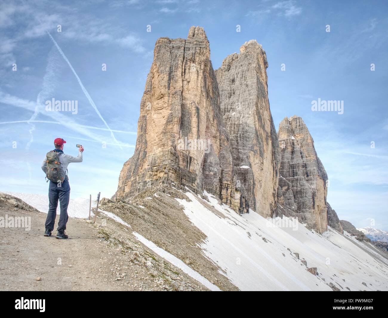 Tourist walk Drei Zinnen round tour. Tre Cime di Lavaredo with hiker ...