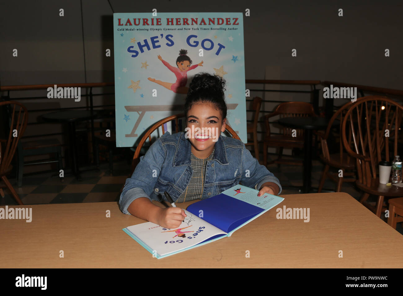 HUNTINGTON, NY - OCT 11: Olympian Laurie Hernandez signs copies of her ...