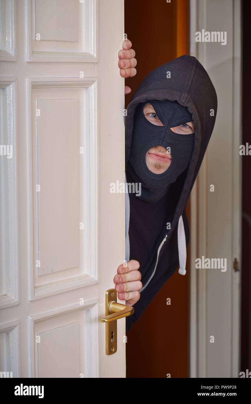 Burglar entering a home Stock Photo - Alamy
