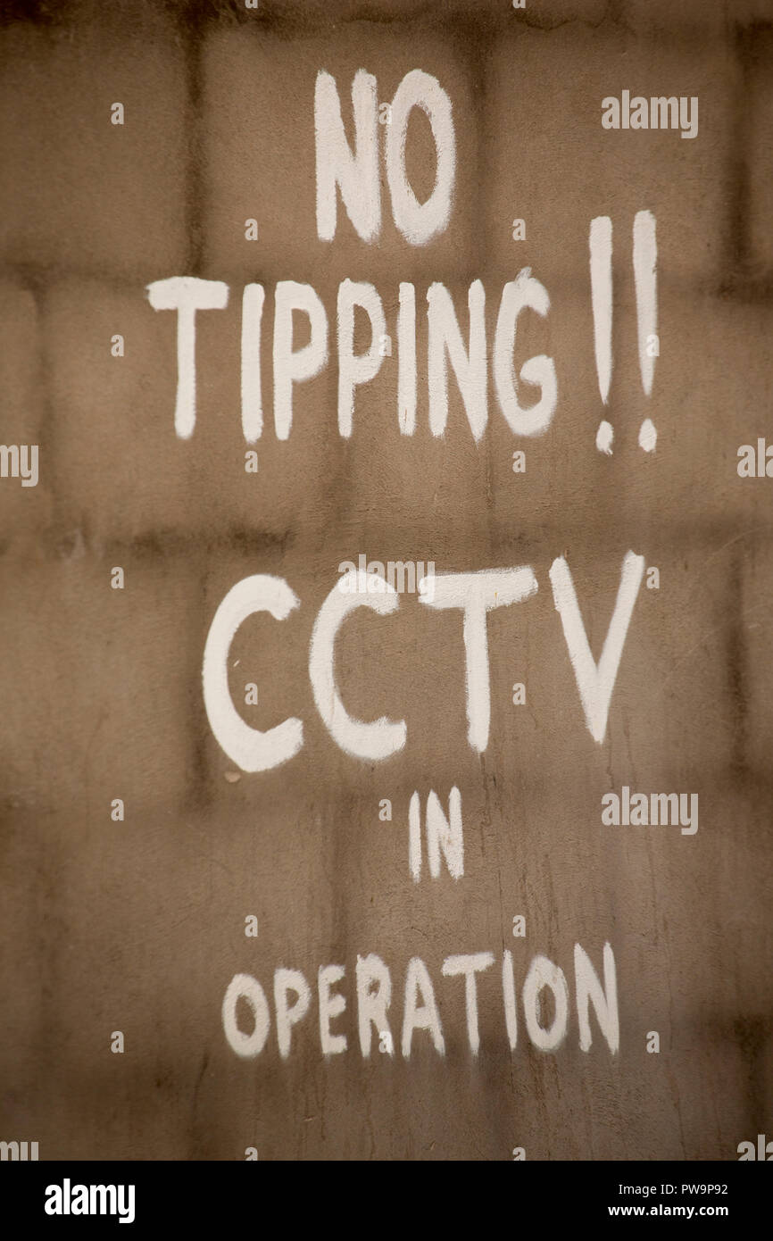 A sign warning that surveillance cameras are in operation to prevent ...