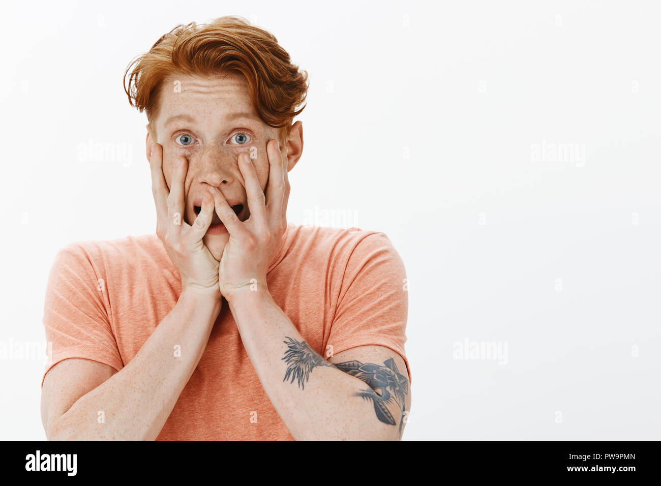 Man peeking over wall hi-res stock photography and images - Alamy