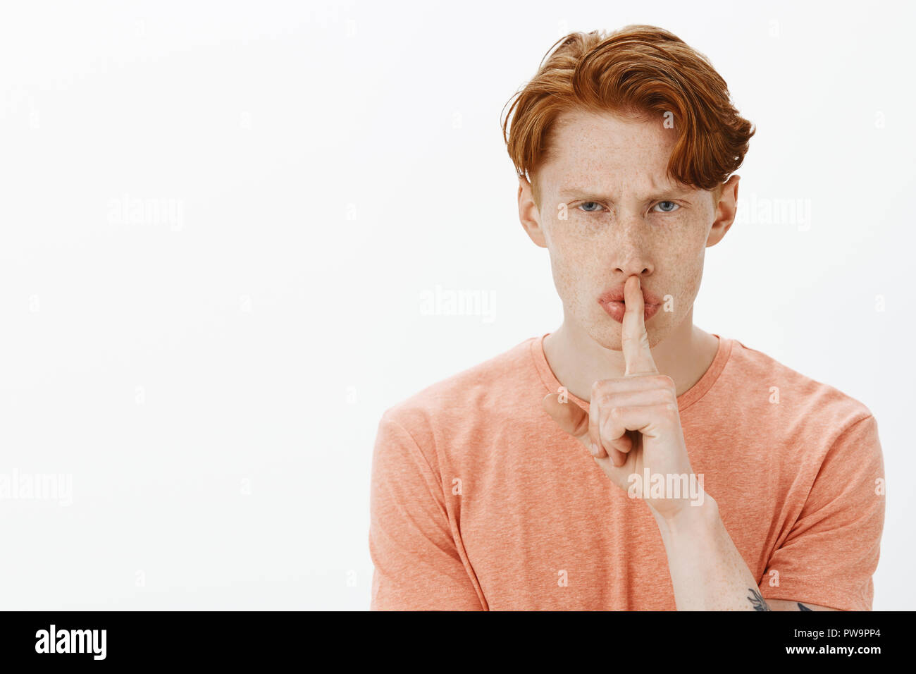 Shh, keep voice down and listen. Portrait of strict serious-looking ...