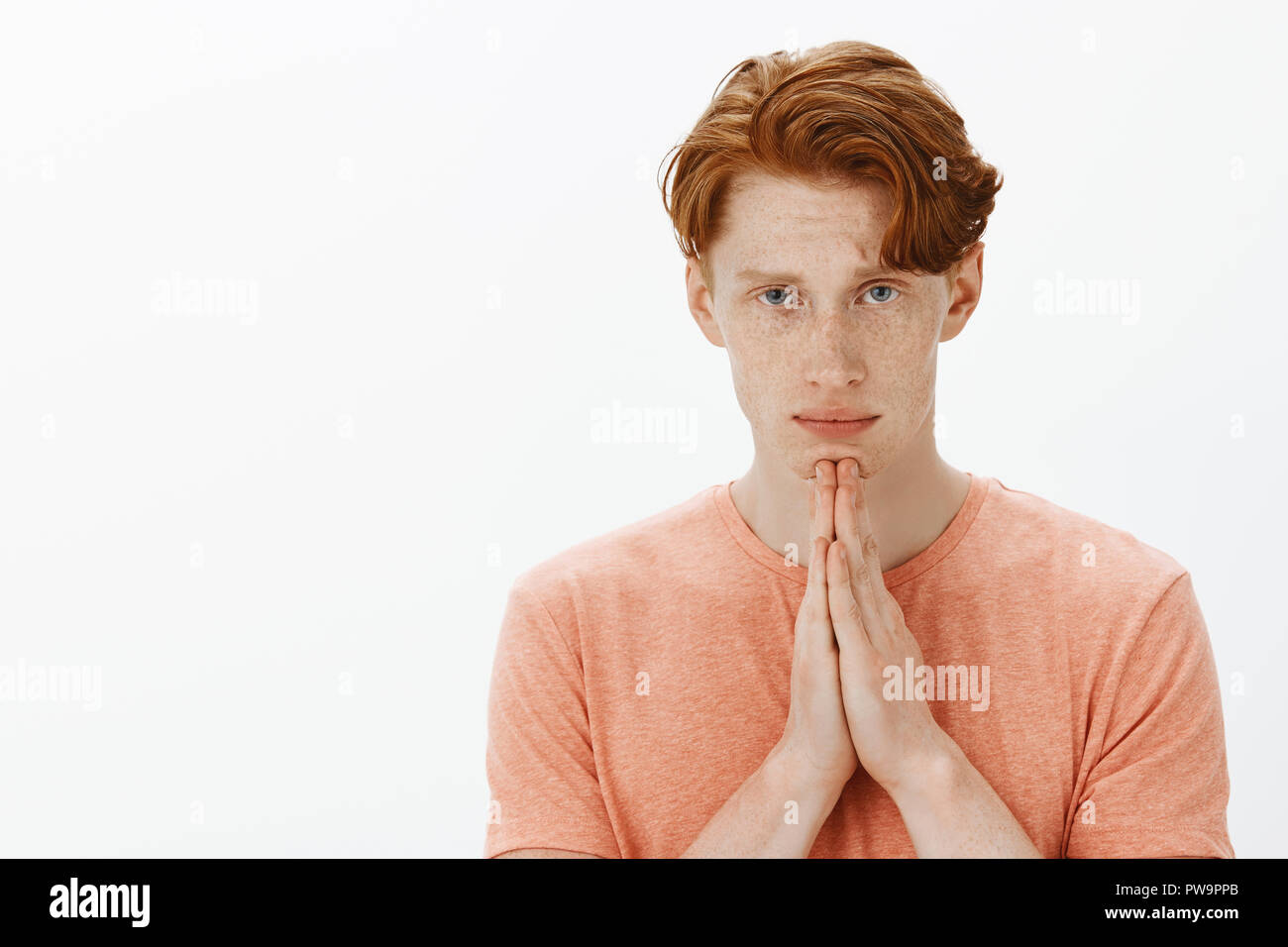 Handsome young ginger guy with stylish hairstyle and freckles, holding ...