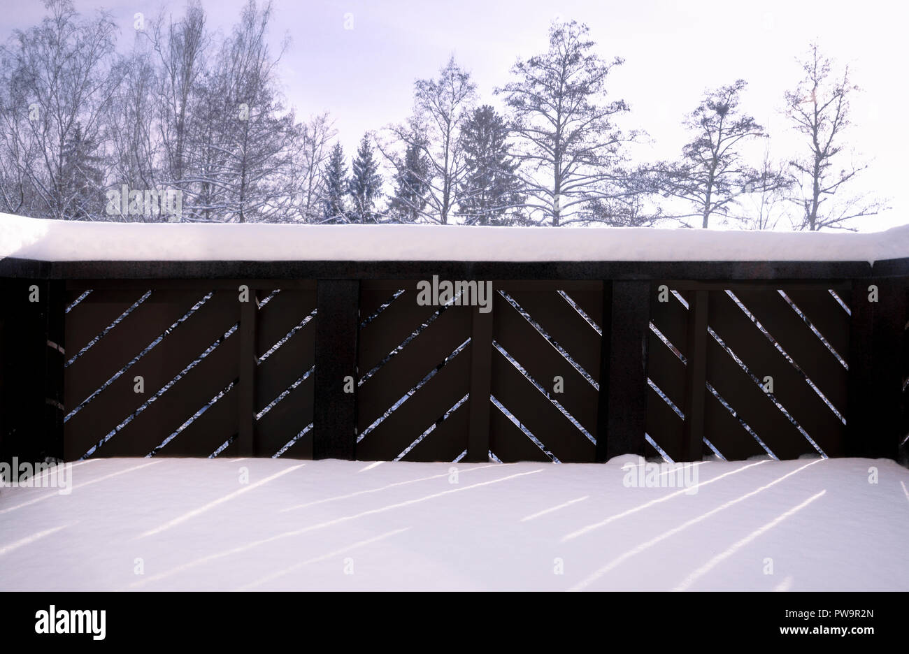 Beautiful winter scenery from a german house balcony with wooden ...