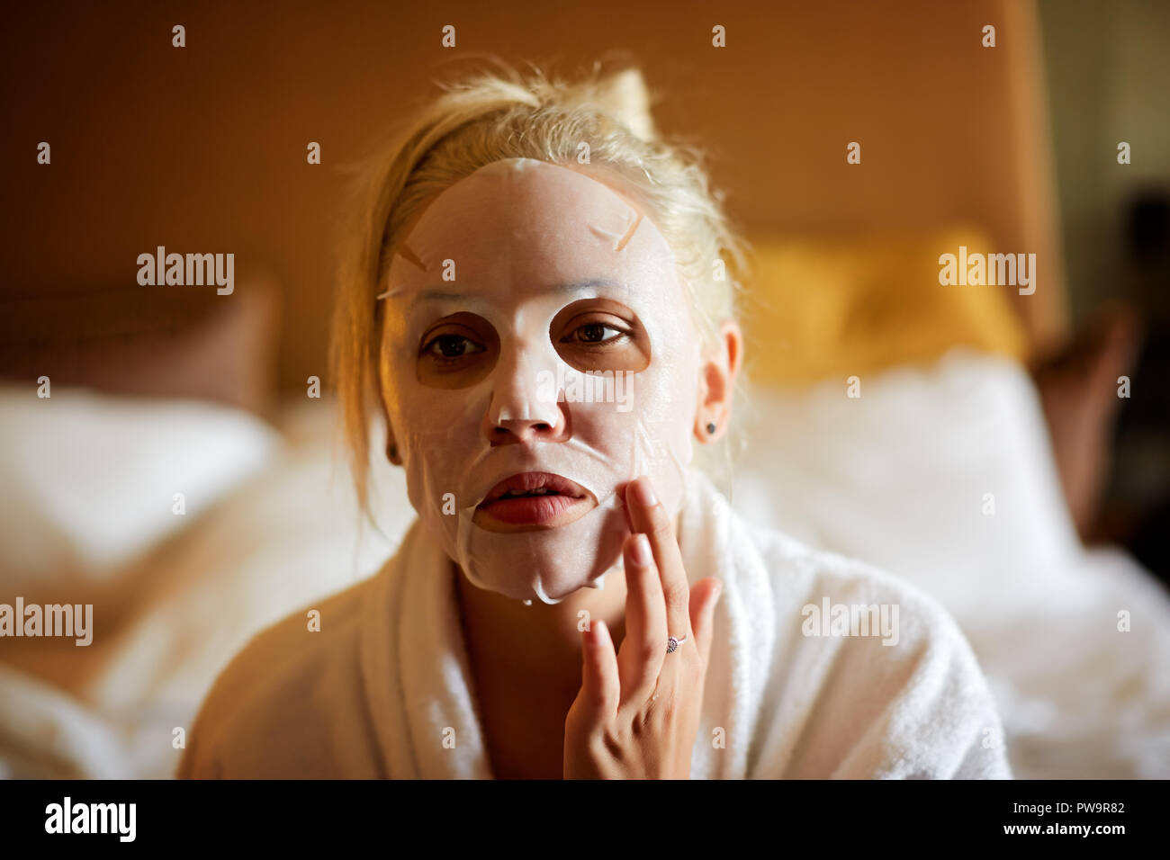 Beautiful woman in a face mask, clean skin, healthy appearance Stock ...