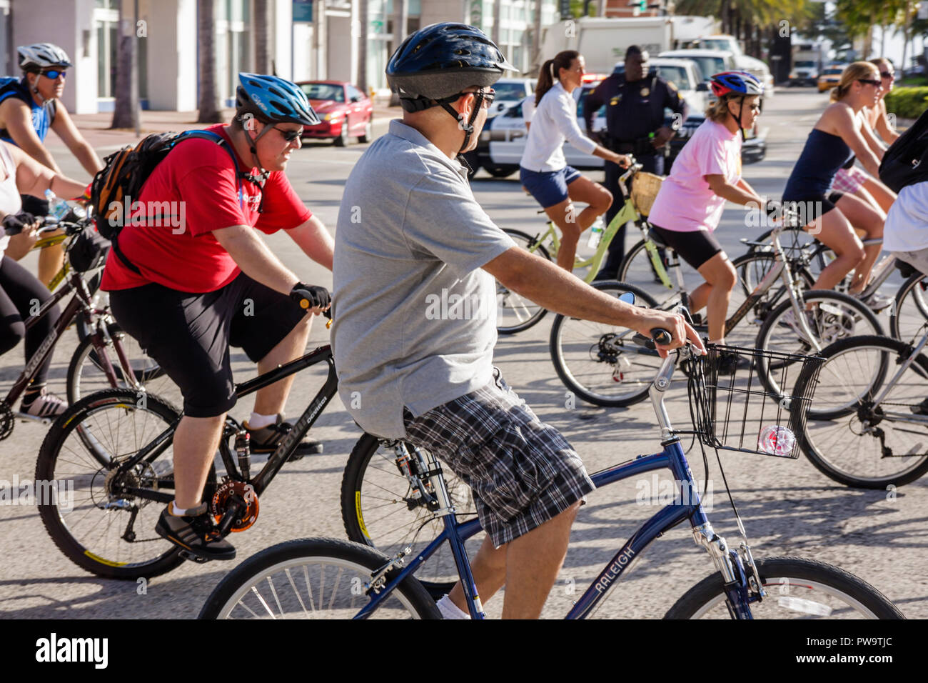 Woman riding bicycle in beach hi-res stock photography and images - Alamy