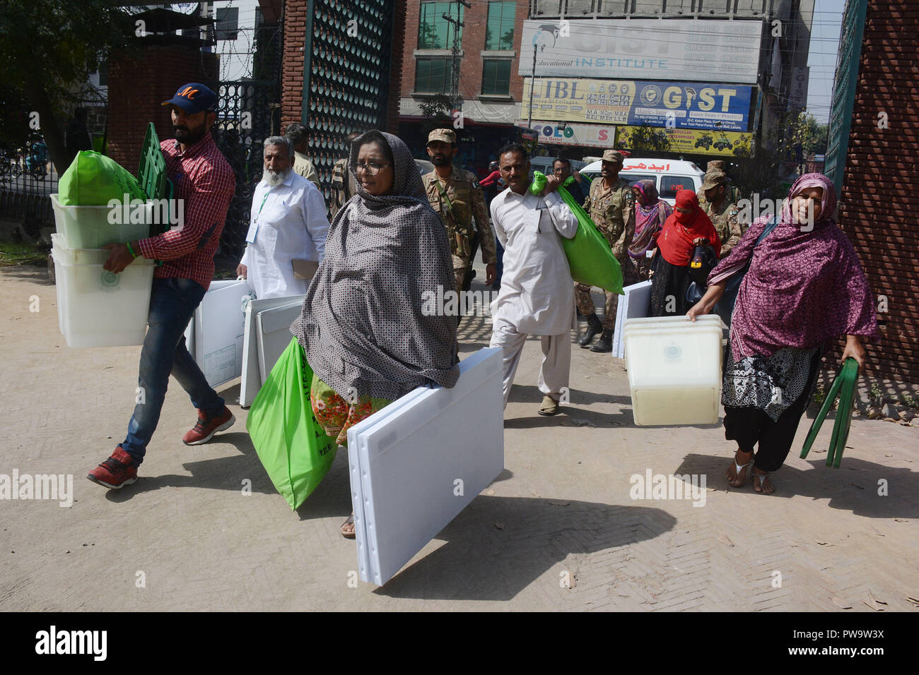 Election staff carry ballot boxes hi-res stock photography and images ...