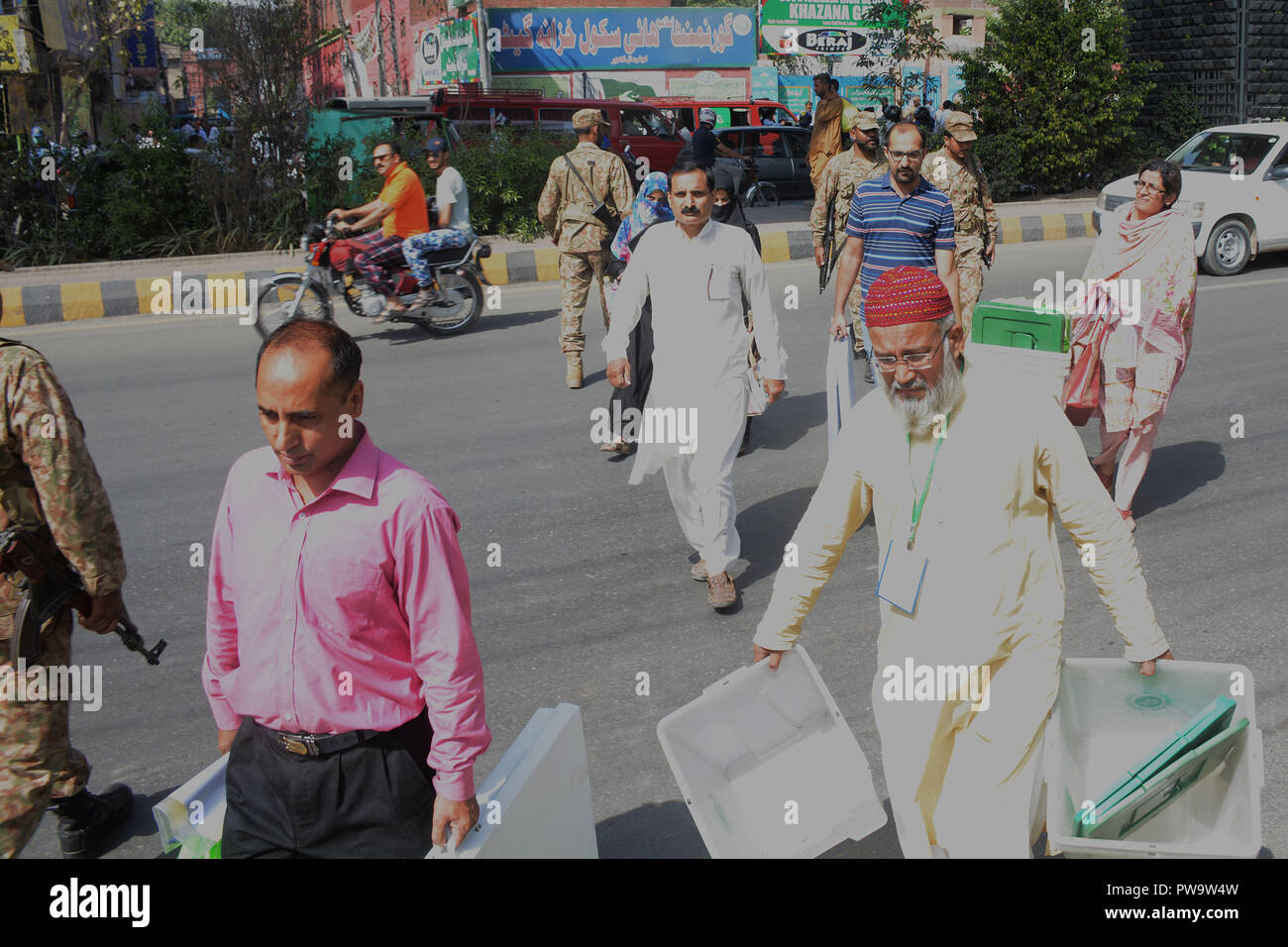 Election staff carry ballot boxes hi-res stock photography and images ...