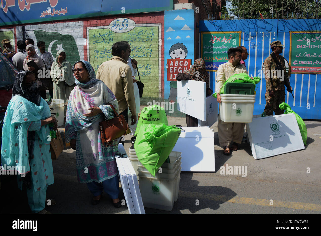 Election staff carry ballot boxes hi-res stock photography and images ...