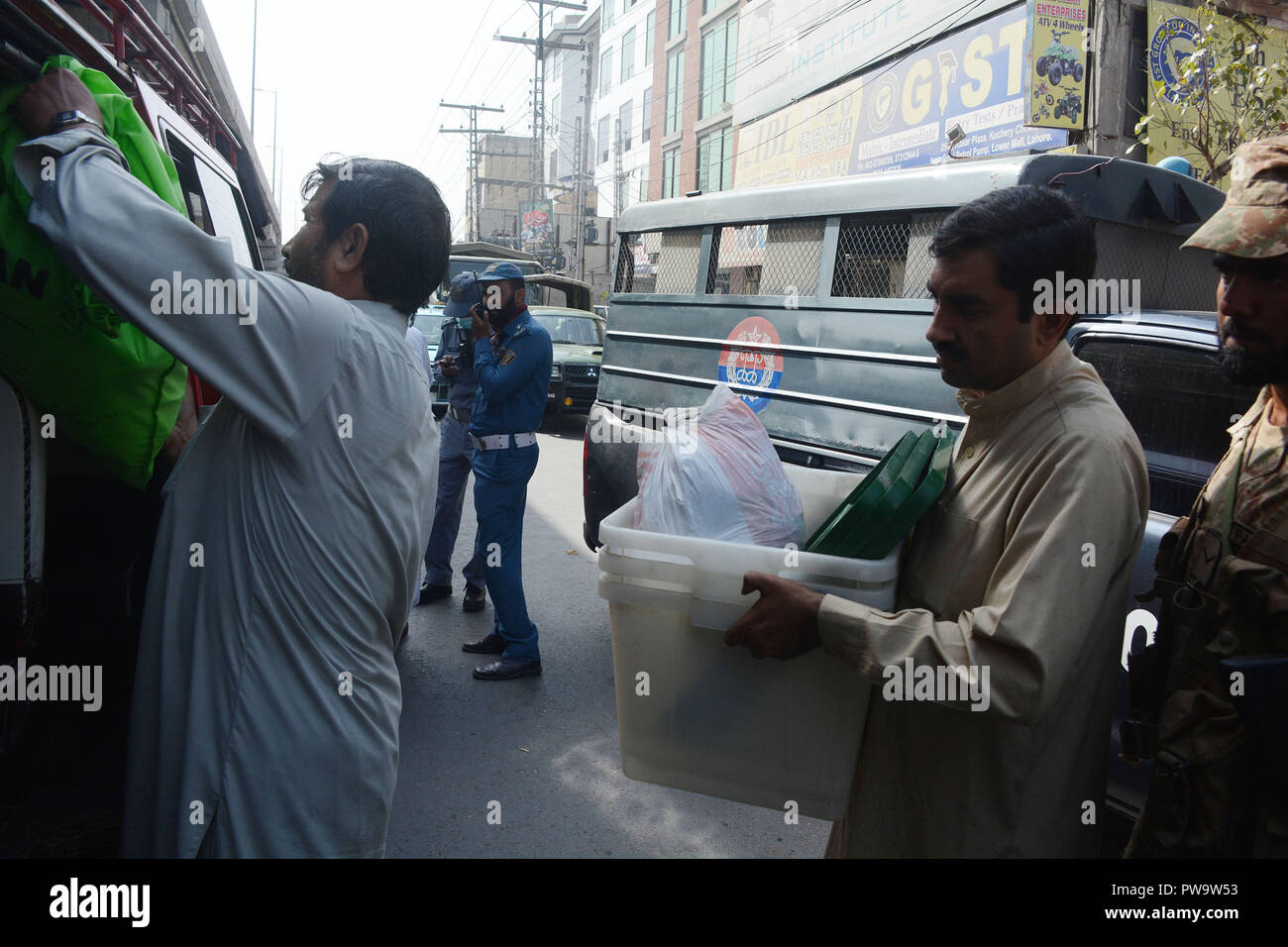 Election staff carry ballot boxes hi-res stock photography and images ...