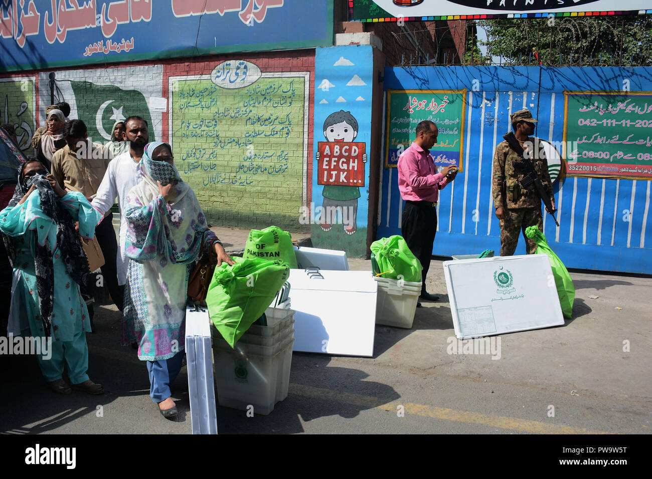 Election staff carry ballot boxes hi-res stock photography and images ...