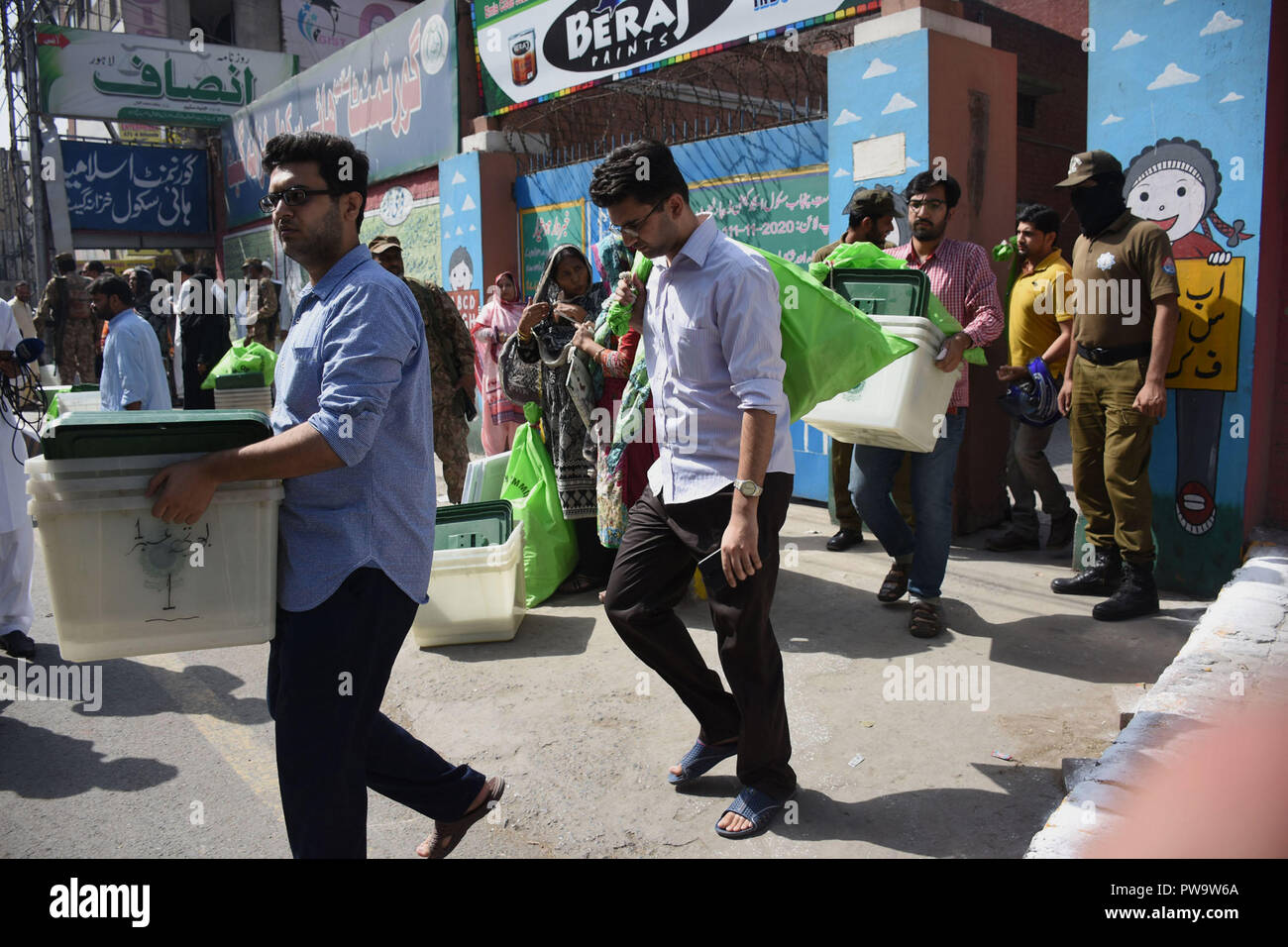 Election staff carry ballot boxes hi-res stock photography and images ...