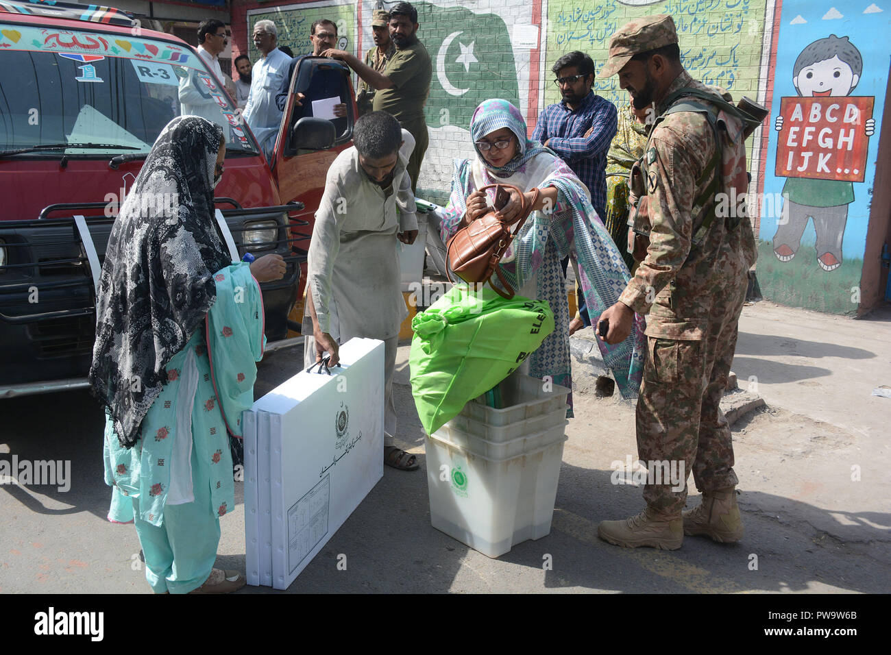 Election staff carry ballot boxes hi-res stock photography and images ...