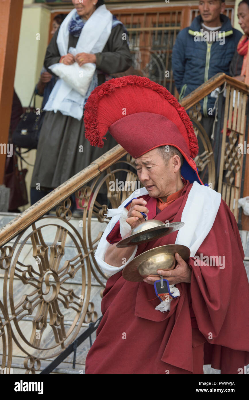 Red hat monk at a traditional Tara prayer ritual, Leh, Ladakh, India ...
