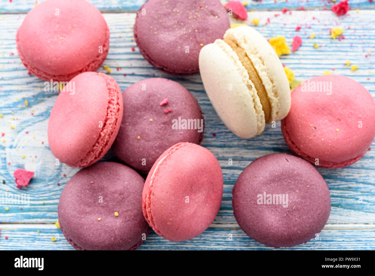 Sweet macarons on a blue background. Trendy cakes Stock Photo - Alamy