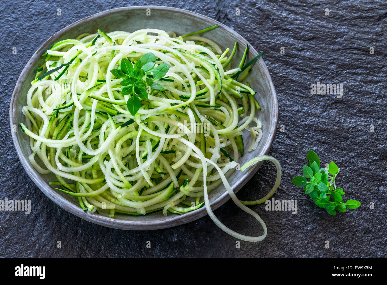 Courgette spaghetti - shredded courgette on a plate - top view Stock ...