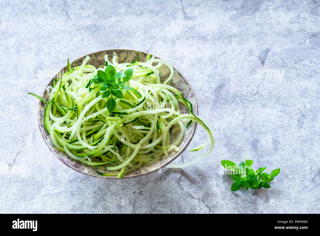 Courgette spaghetti - shredded courgette in a bowl - top view Stock ...