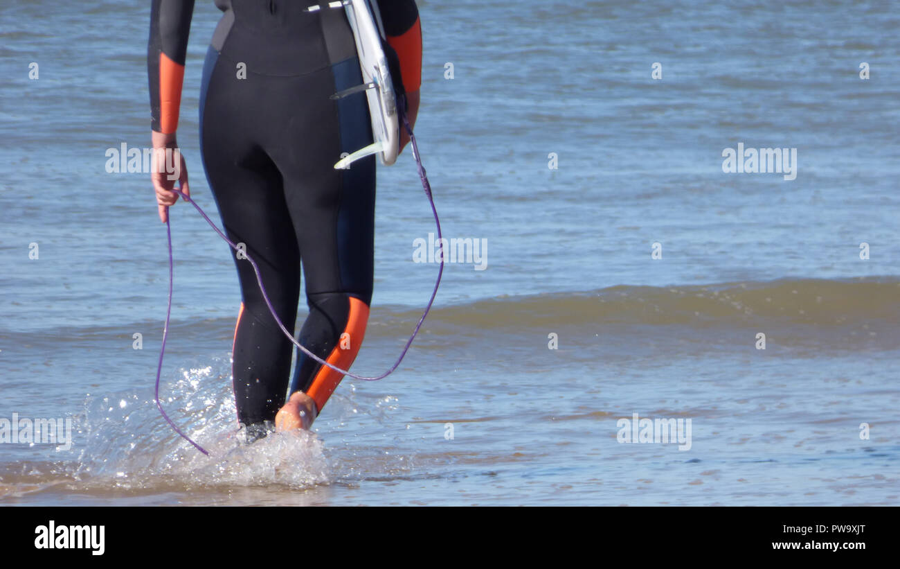 Surfer Legs Walking on Becah Holding Surfboard Ocean Stock Photo - Alamy