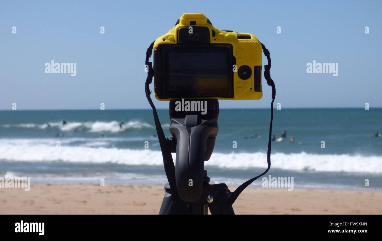 Silhouette of woman taking pictures of sunset hi-res stock photography ...