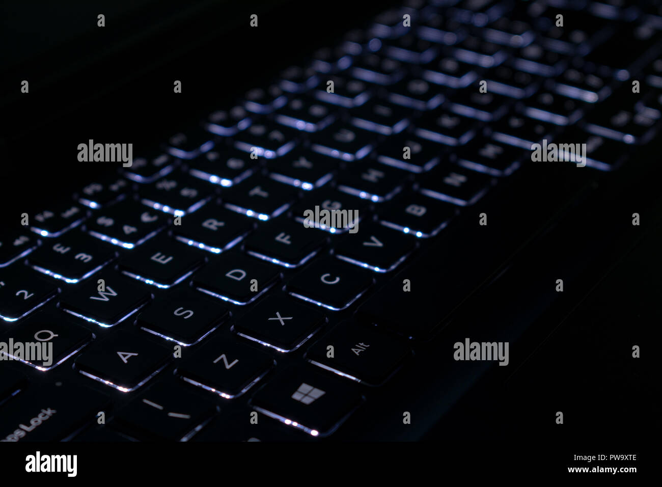 Laptop keyboard illuminated, back-lit, close up Stock Photo - Alamy
